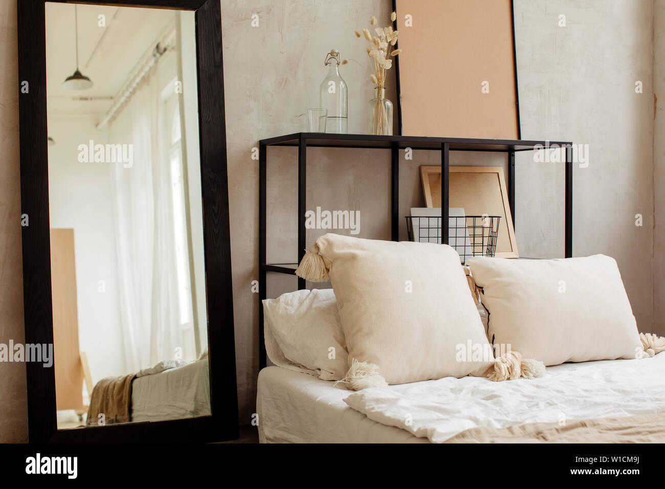 Bed with pillows and beautiful linens of warm colors Stock Photo - Alamy