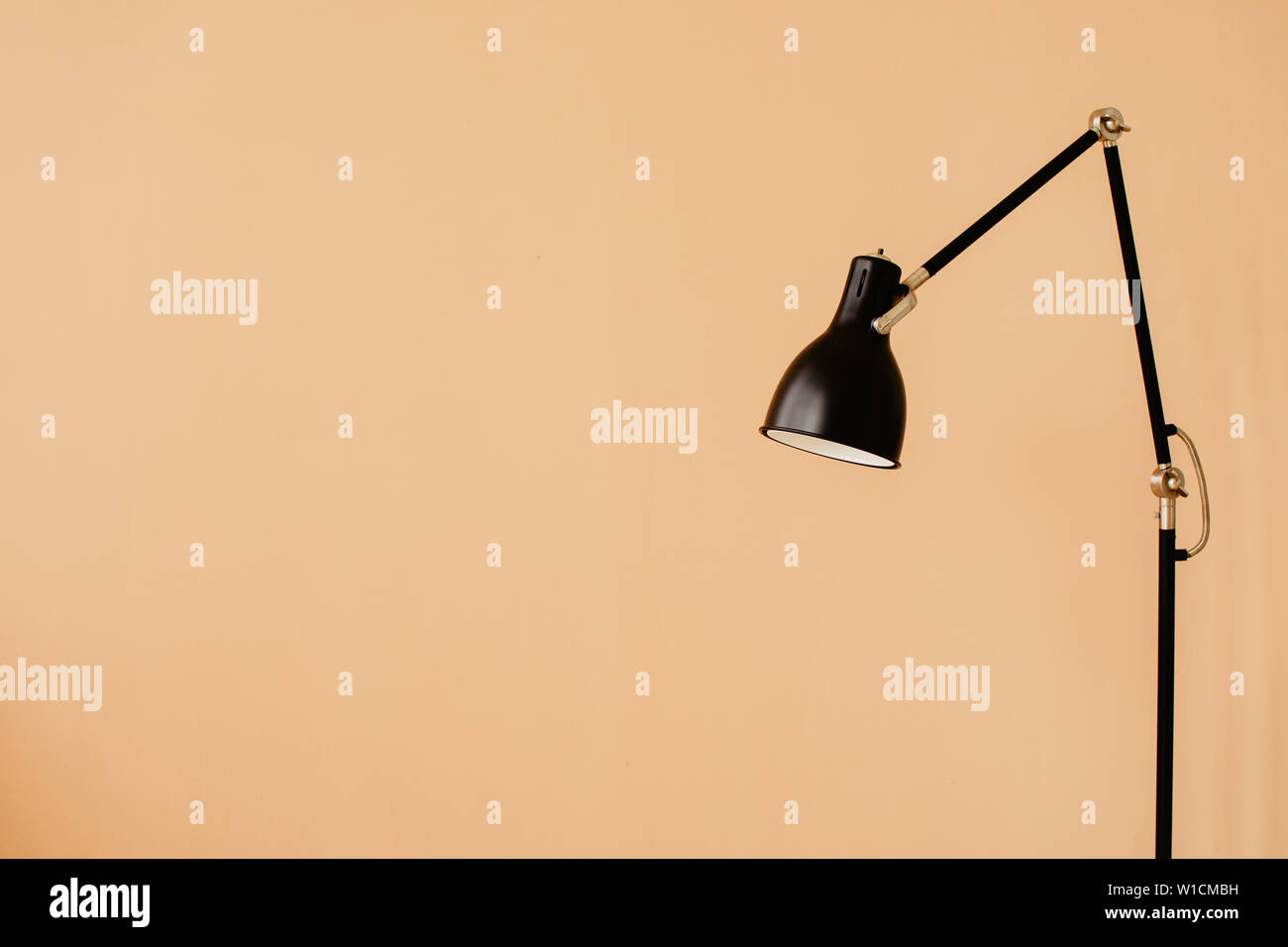 Stylish floor lamp in apartment Stock Photo - Alamy