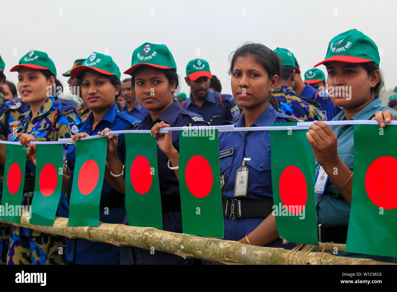 Women participate at the event titled “Lakho Konthe Shonar Bangla ...