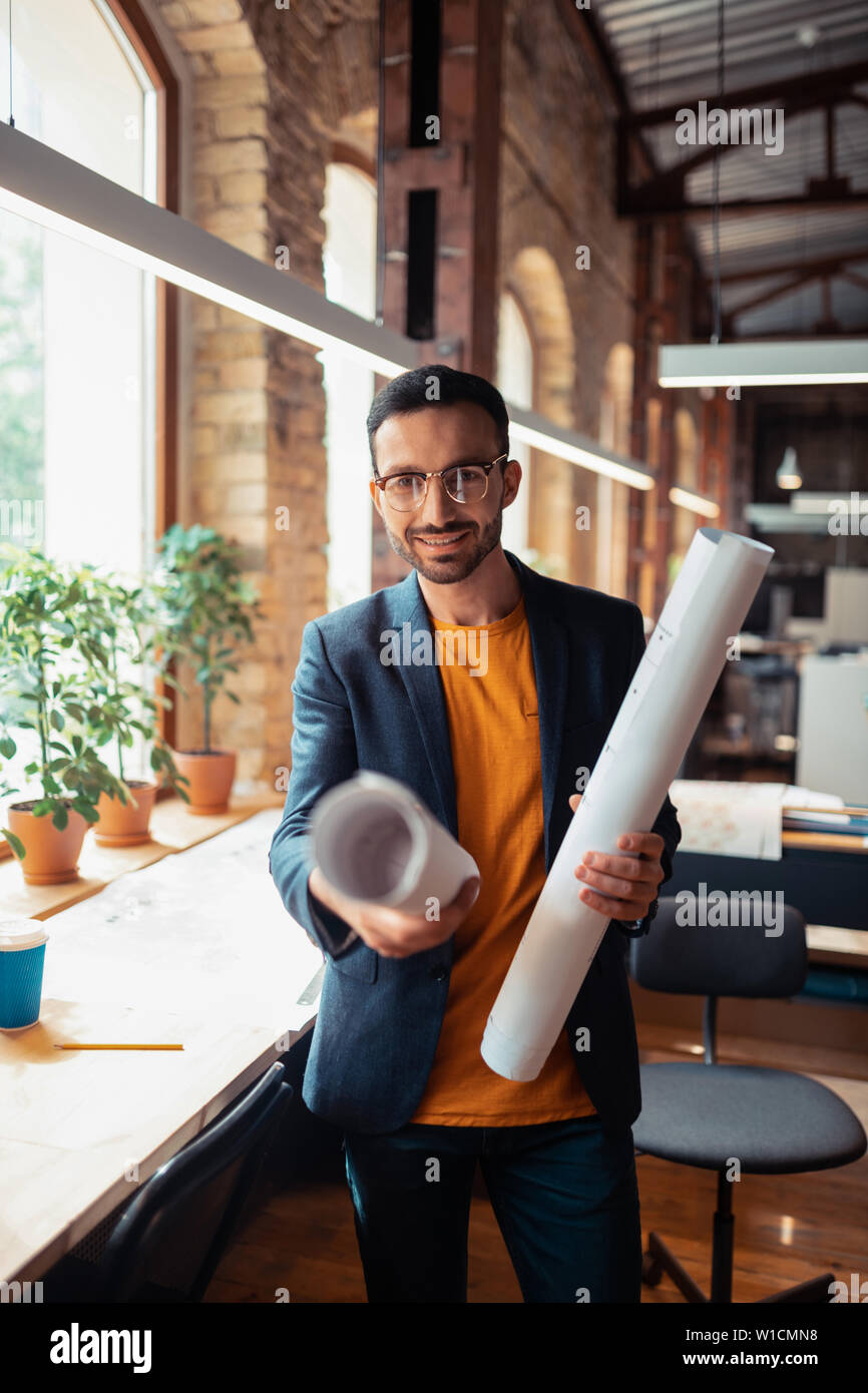 Handsome interior designer. Handsome interior designer wearing glasses ...