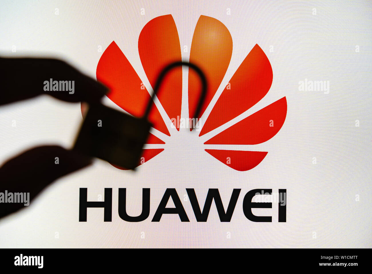 Huawei logo in background with silhouette of a unlock padlock and a key ...