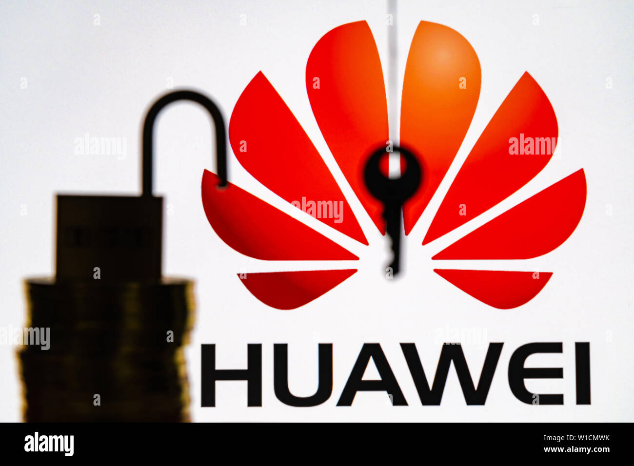 Huawei logo in background with silhouette of a unlock padlock and a key ...