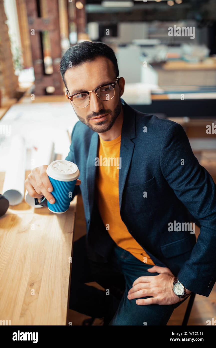 Coffee time. Top view of man wearing stylish jacket drinking coffee ...