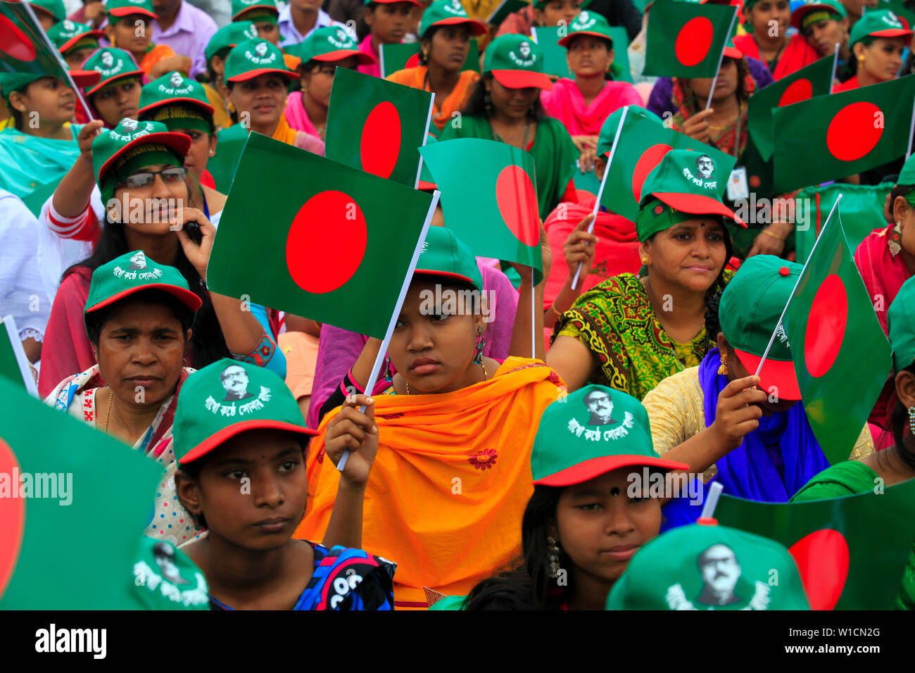 Women participate in the event titled “Lakho Konthe Shonar Bangla ...
