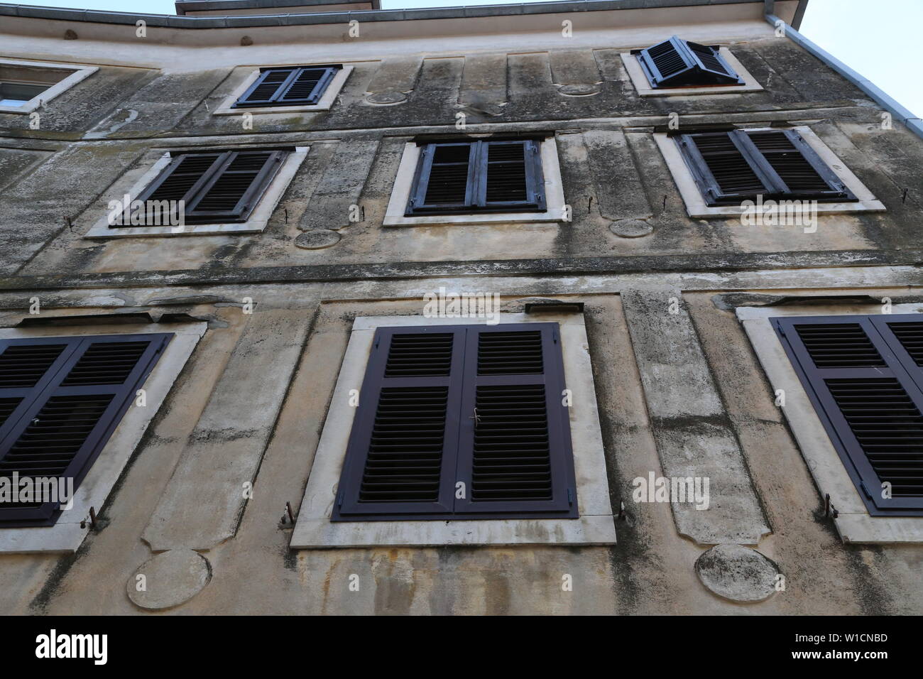 Shuttered windows. Old houses with shuttered windows Stock Photo - Alamy
