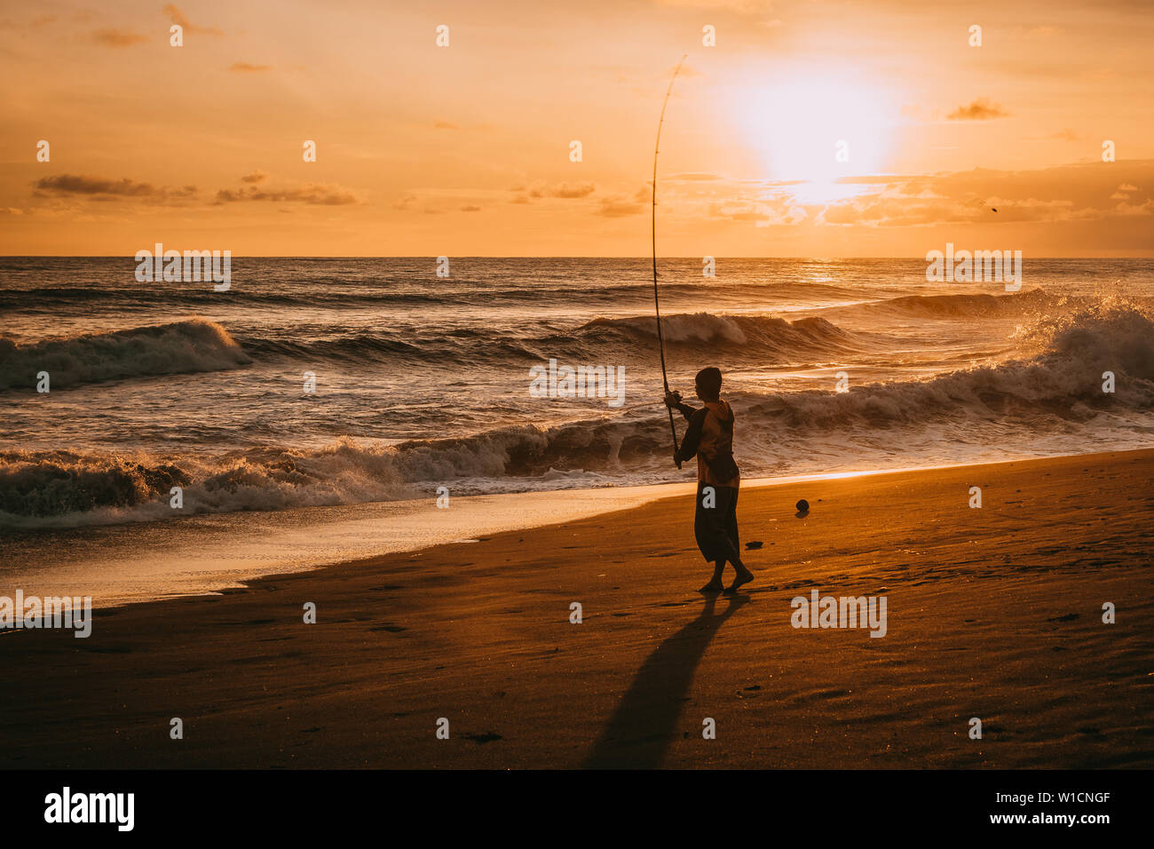 Fishing on The Sun Stock Photo - Alamy