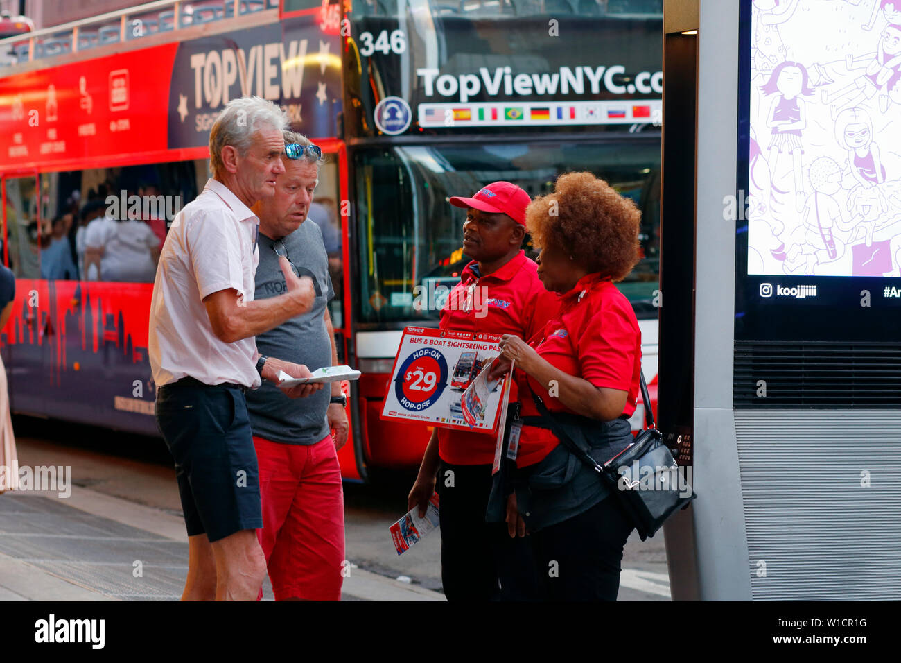 A pair of ticket touts in Times Square soliciting tourists Stock Photo ...