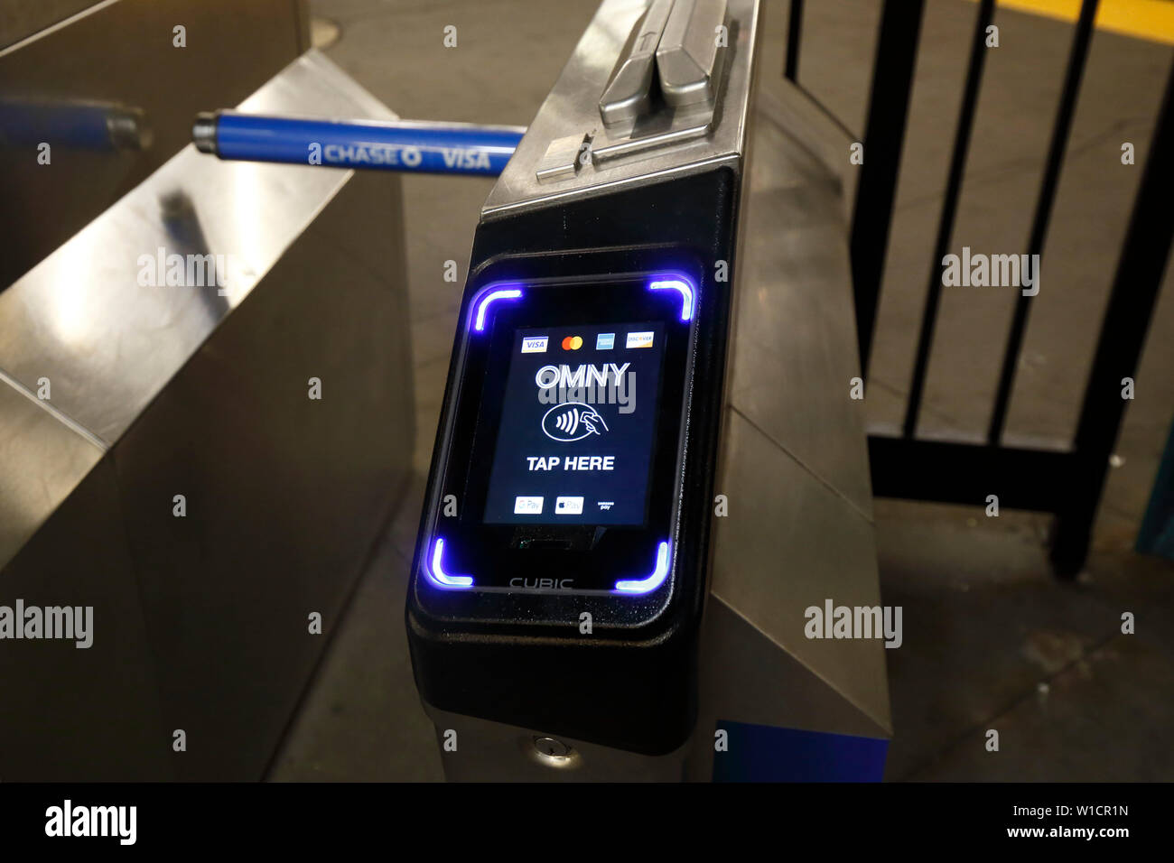 A NYC Subway turnstile retrofitted with a contactless payment reader ...