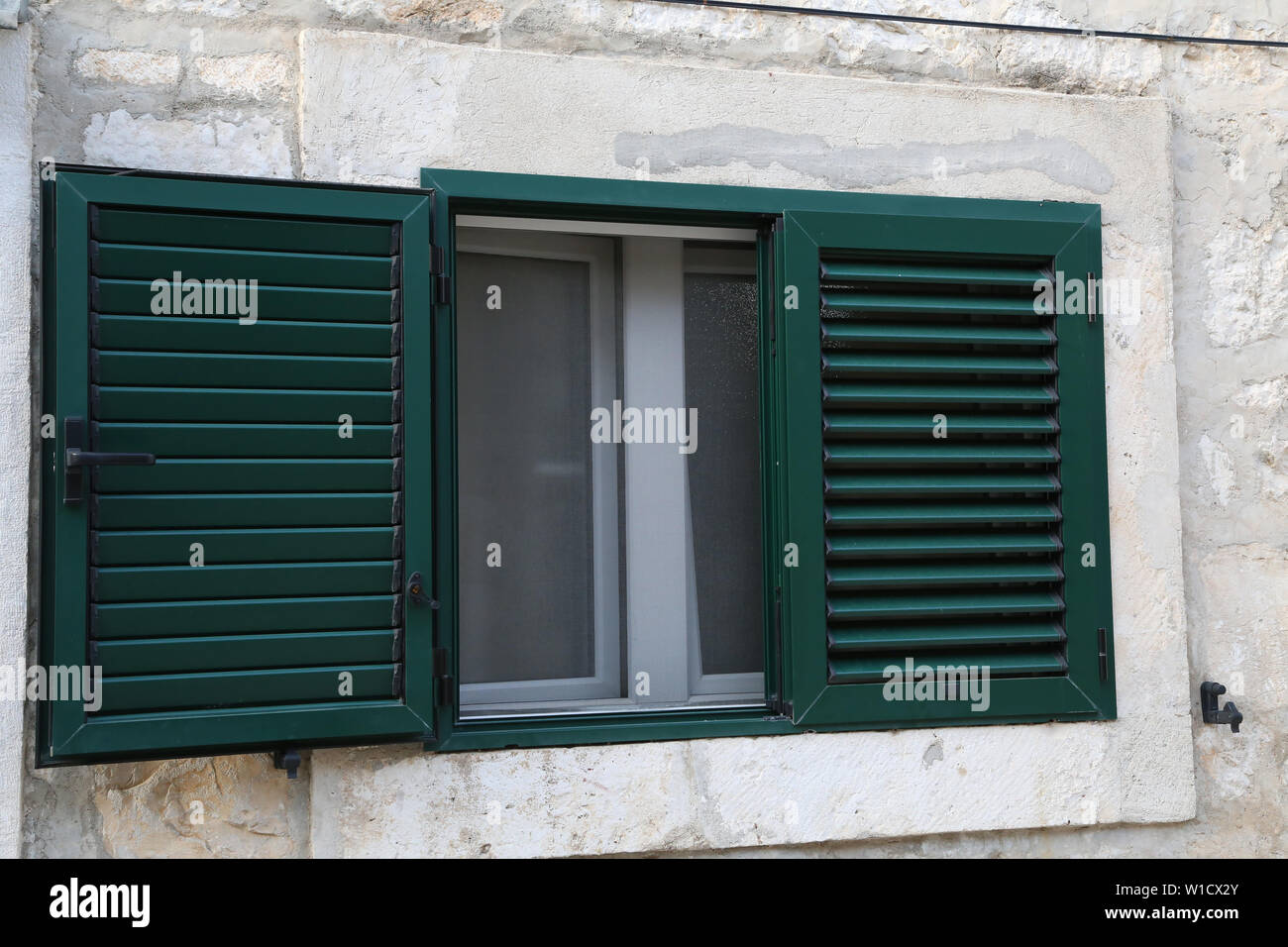Shuttered windows. Old houses with shuttered windows Stock Photo - Alamy