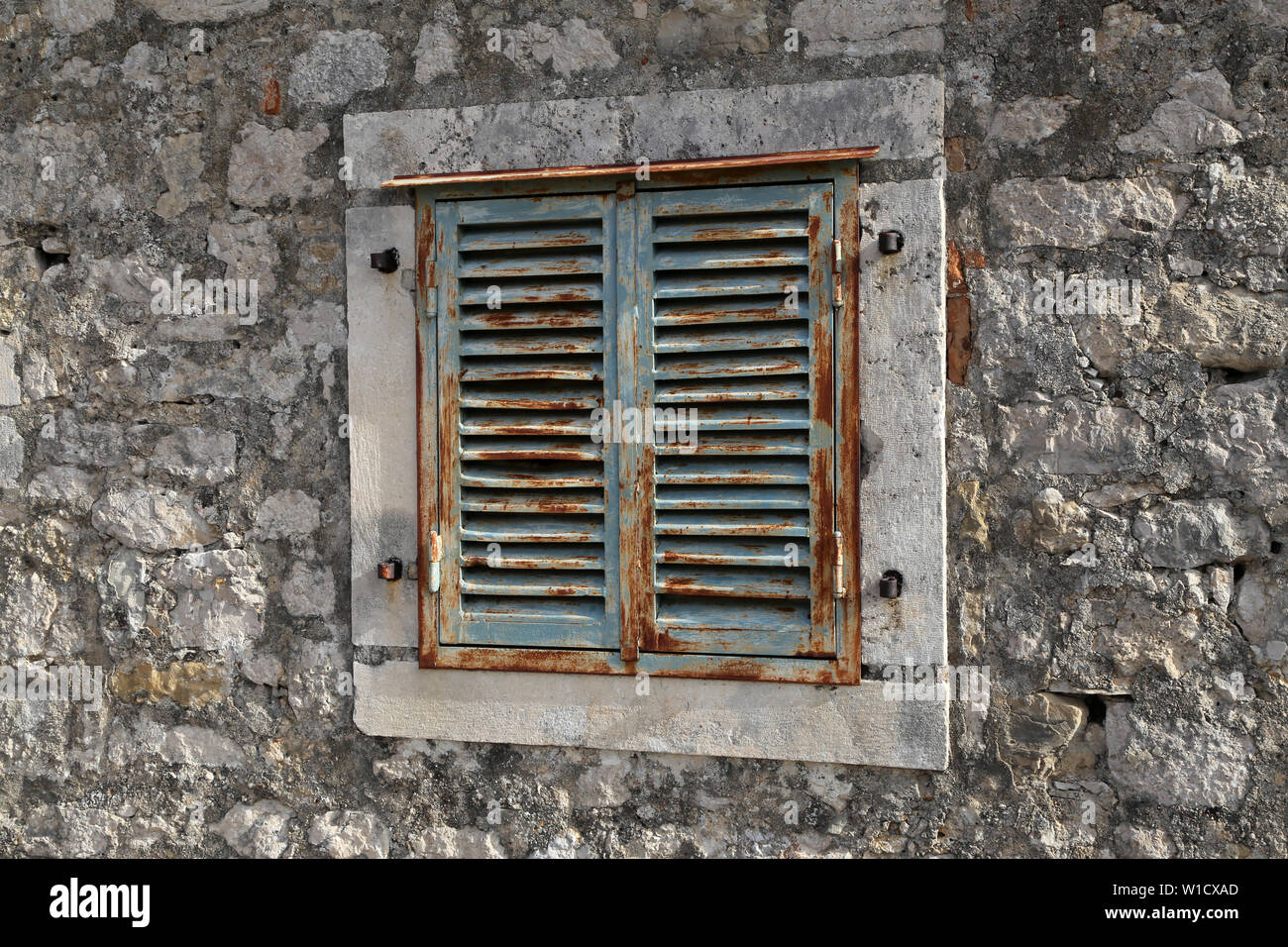 Shuttered windows. Old houses with shuttered windows Stock Photo - Alamy