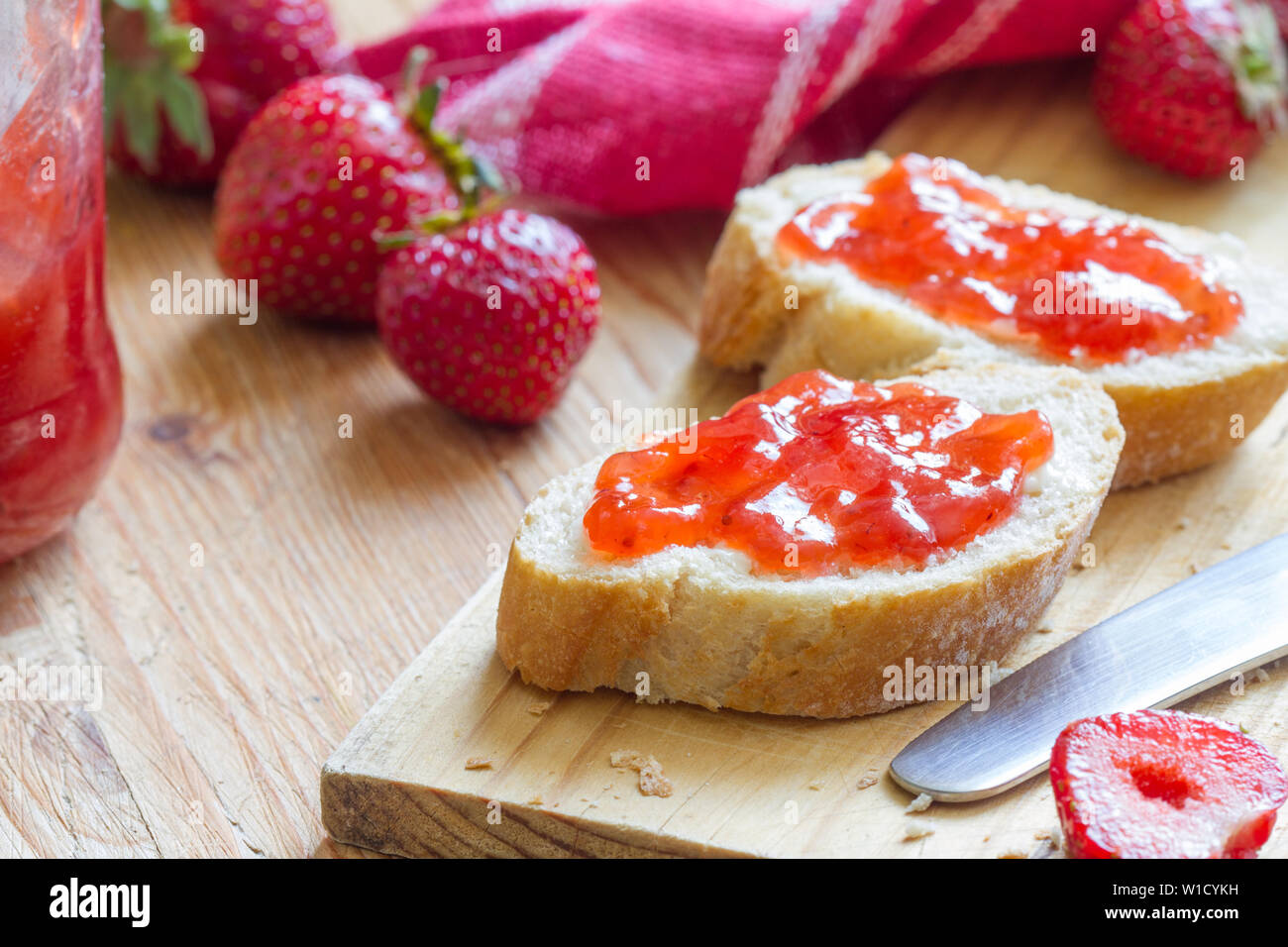 Strawberry organic homemade jam on bread Stock Photo - Alamy
