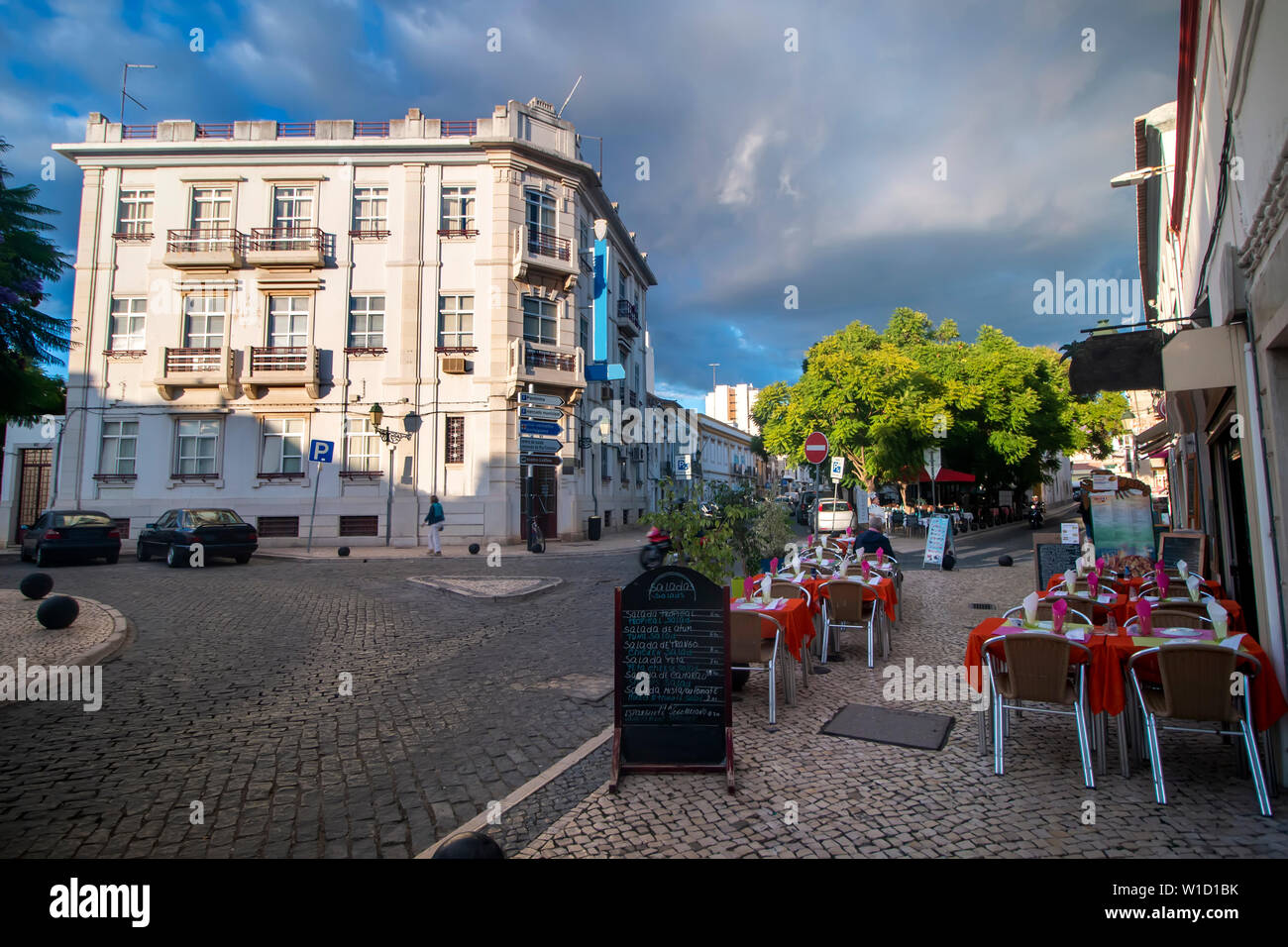 Tourist downtown area of Faro city with cobblestone streets and ...