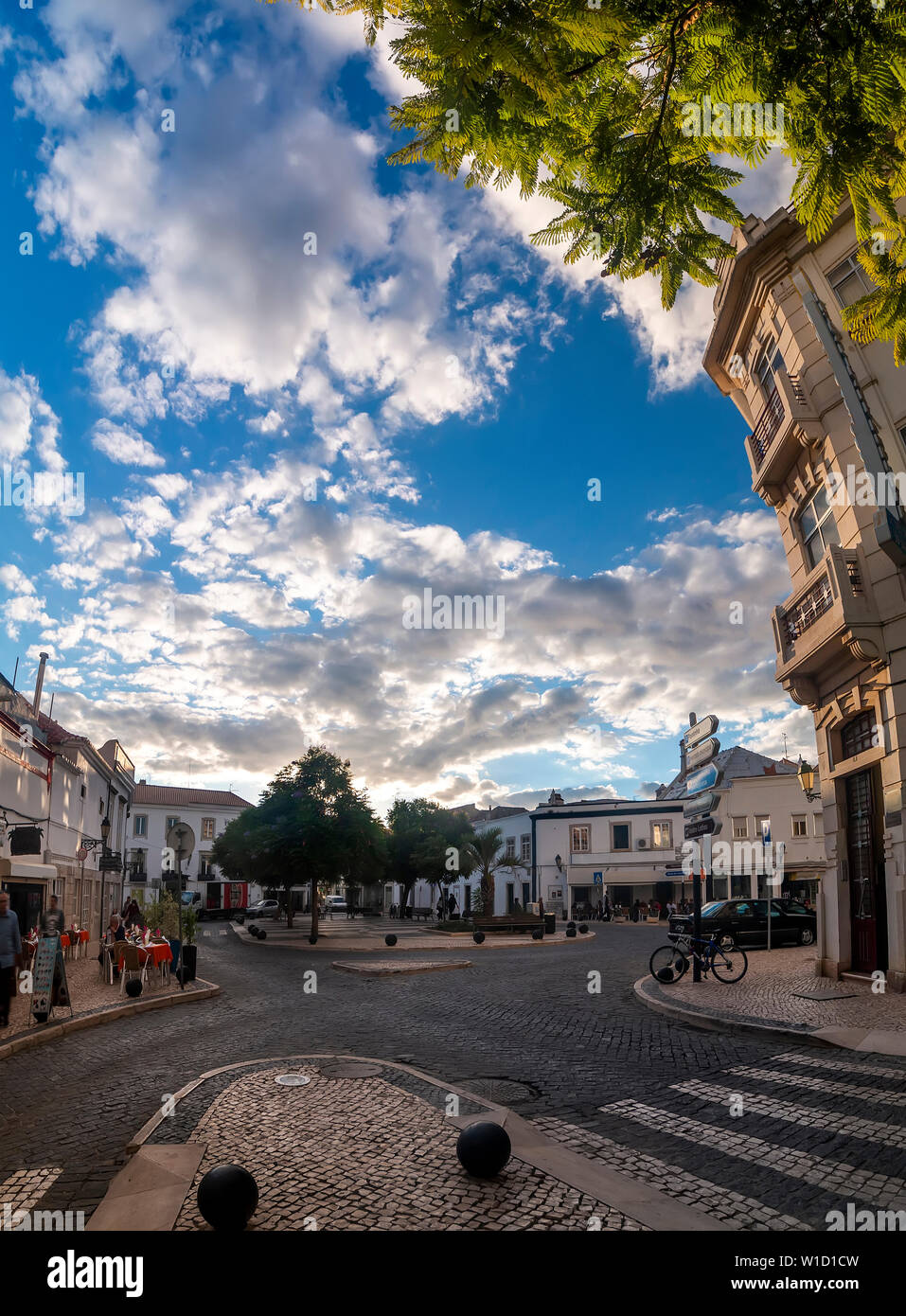Tourist downtown area of Faro city with cobblestone streets and ...