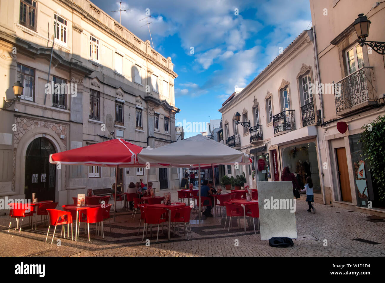Tourist downtown area of Faro city with cobblestone streets and ...