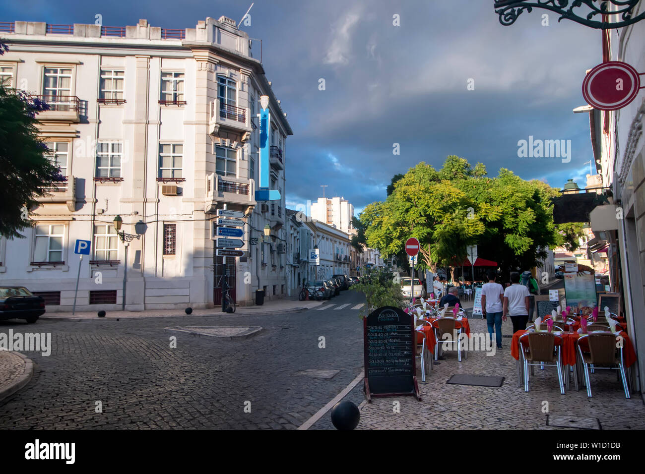 Tourist downtown area of Faro city with cobblestone streets and ...