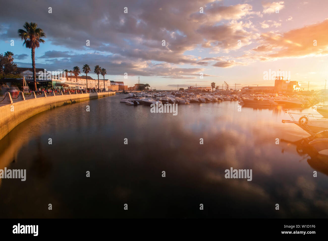 View of the beautiful marina of Faro city at sunset Stock Photo - Alamy