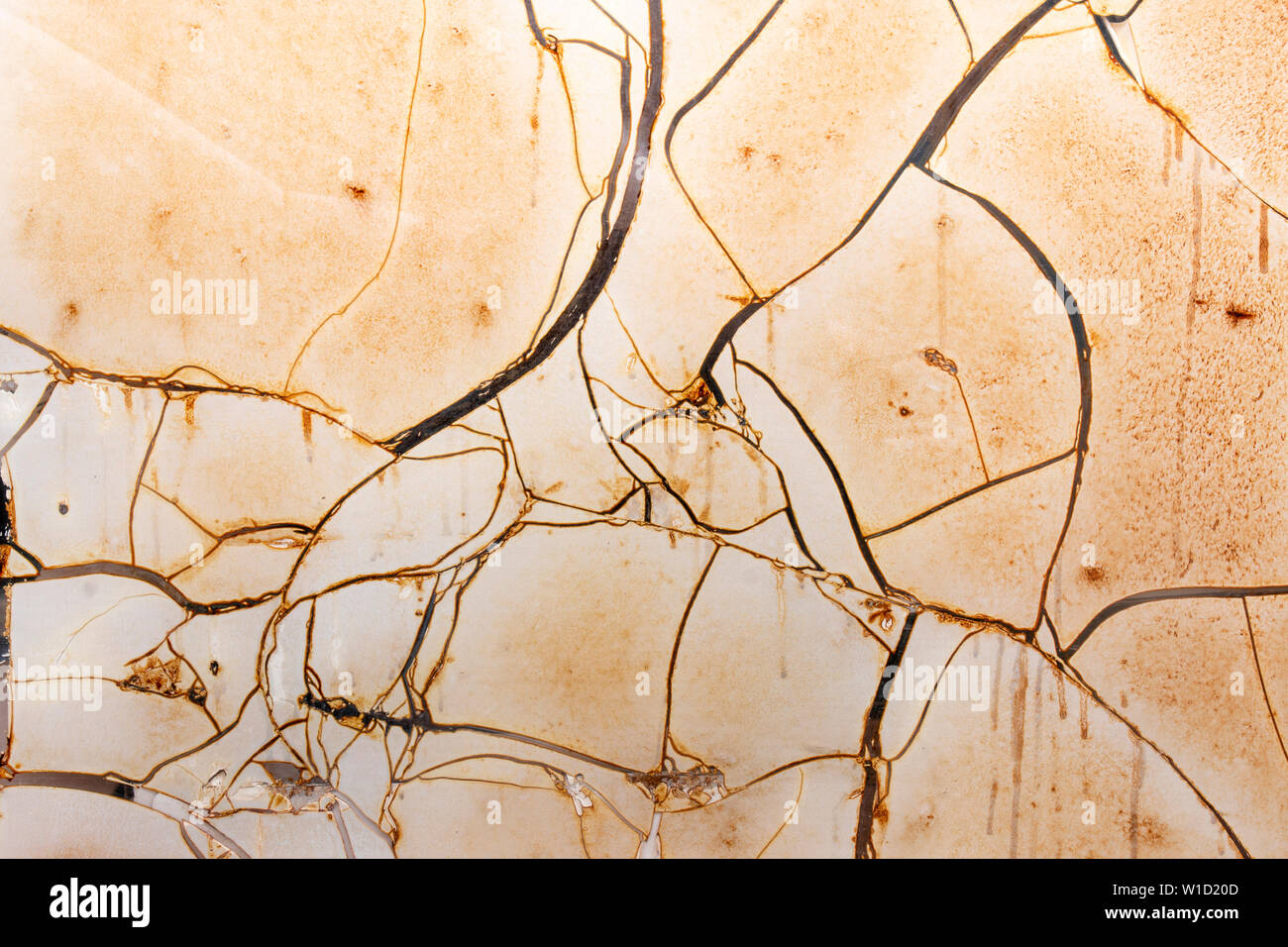 dirty plastic texture with wrinkles, cracks and sunburnt glued to glass ...