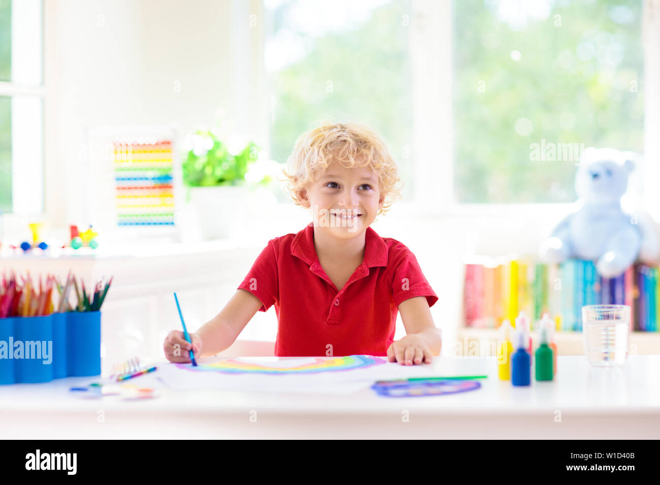 Happy kids doing arts and crafts hi-res stock photography and images ...
