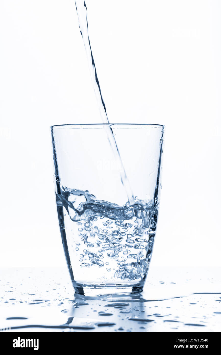 water splashing from glass isolated on white background Stock Photo - Alamy