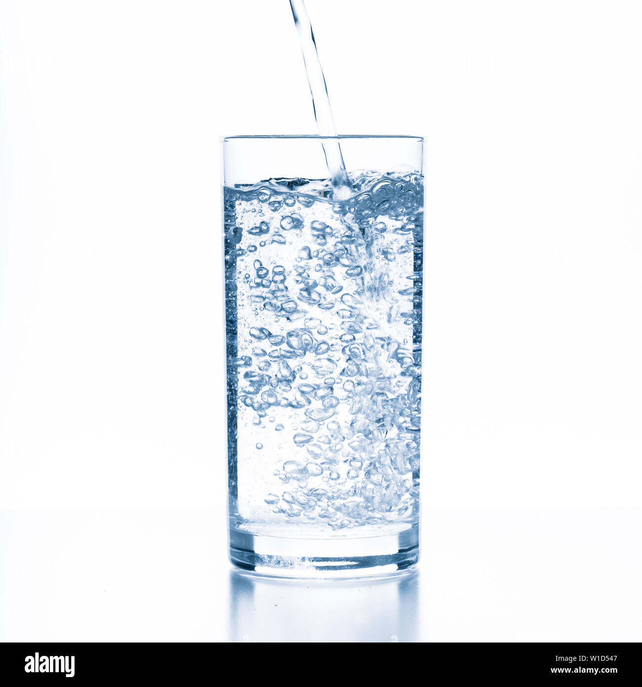 water splashing from glass isolated on white background Stock Photo - Alamy
