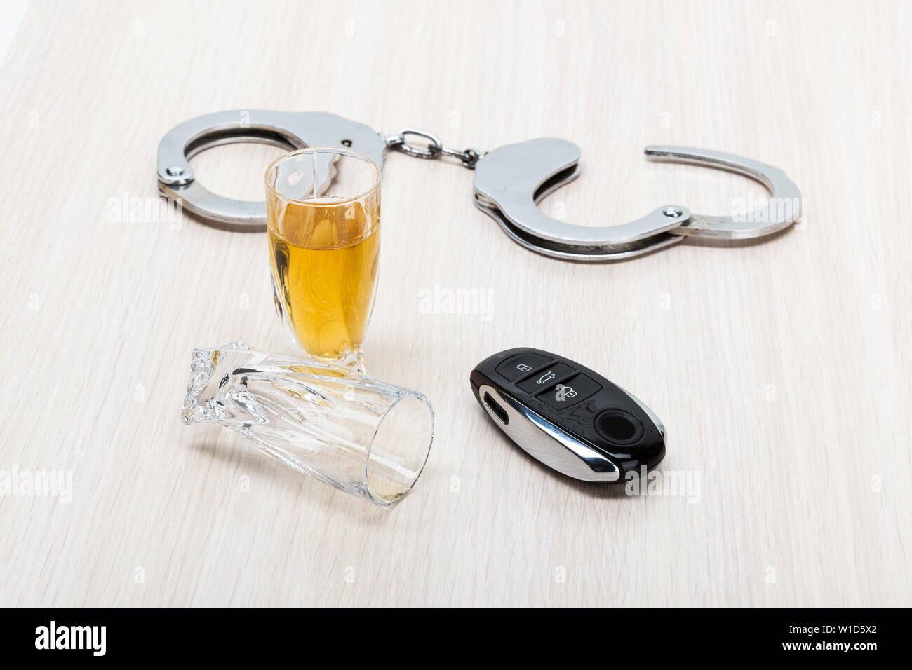 Car key on the bar with spilled alcohol Stock Photo - Alamy