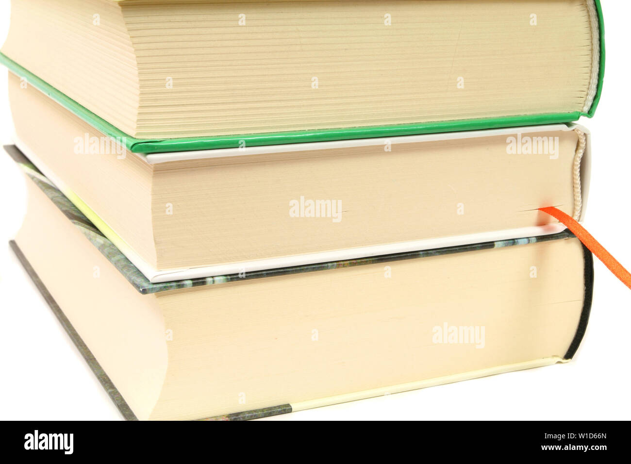 Pile of three big books isolated on white background Stock Photo - Alamy