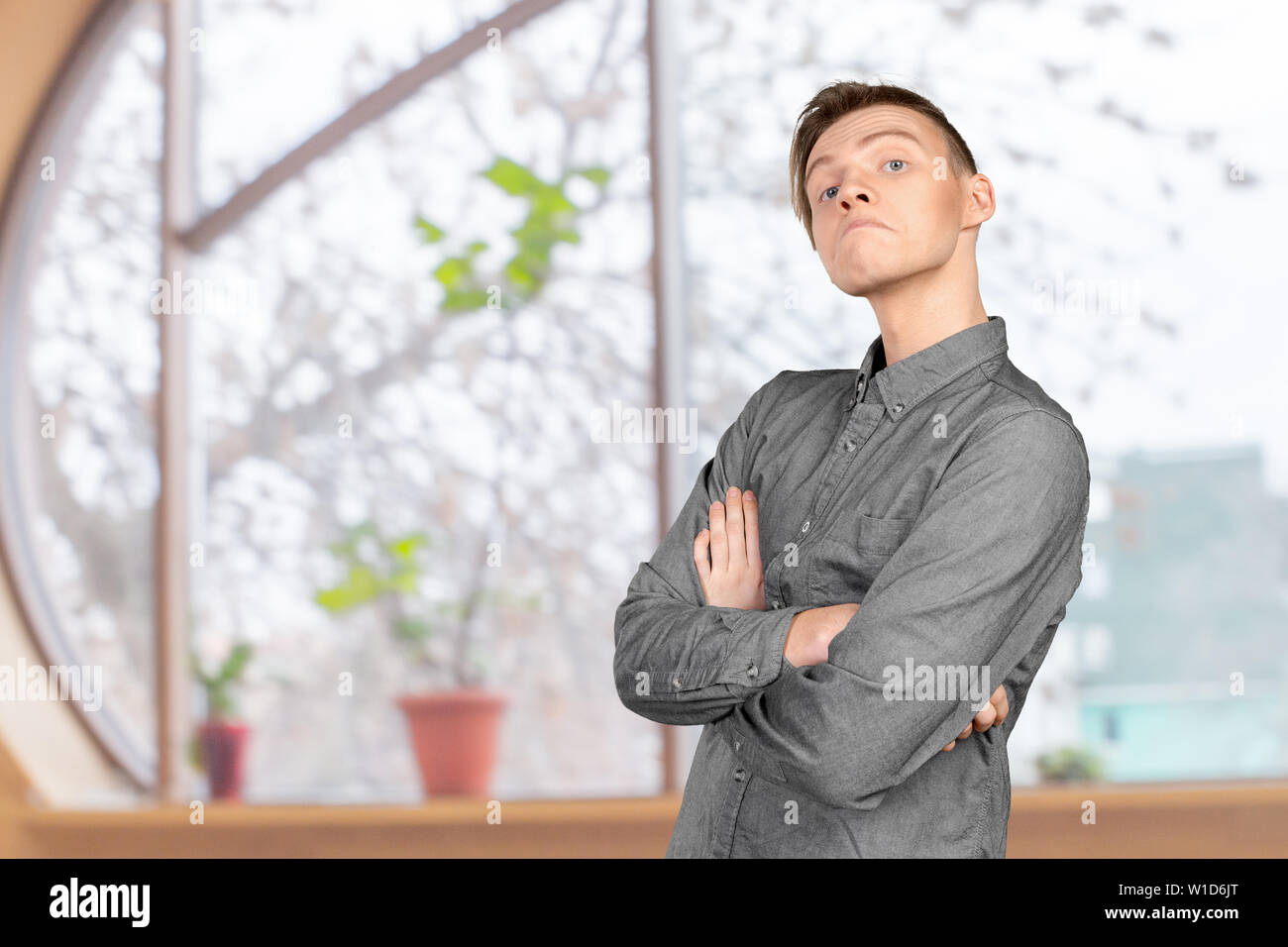 Portrait of young man with shocked facial expression Stock Photo - Alamy