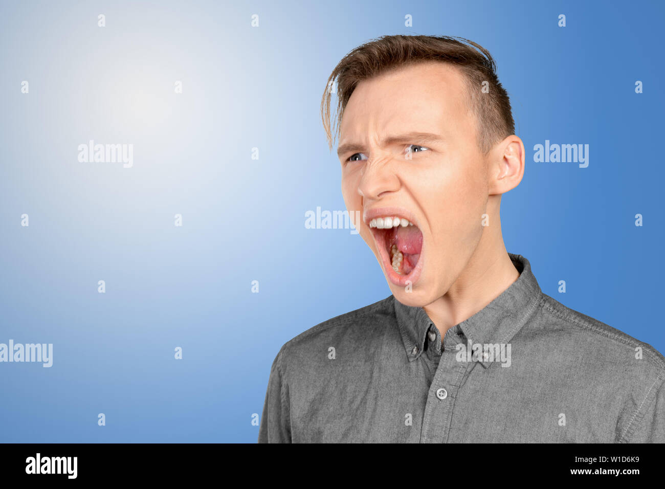 Angry man expressing aggression Stock Photo - Alamy