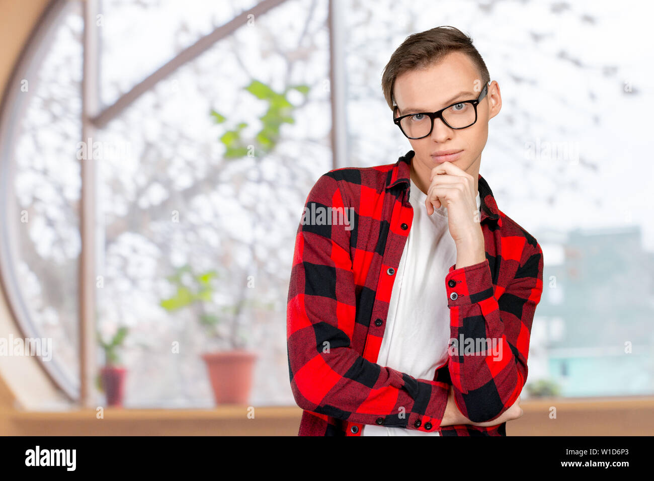 Confused young man thinking Stock Photo - Alamy