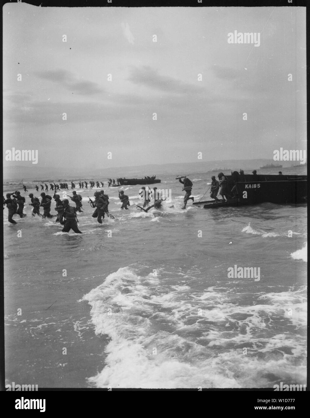 From Coast Guard-manned sea-horse landing craft, American troops leap ...