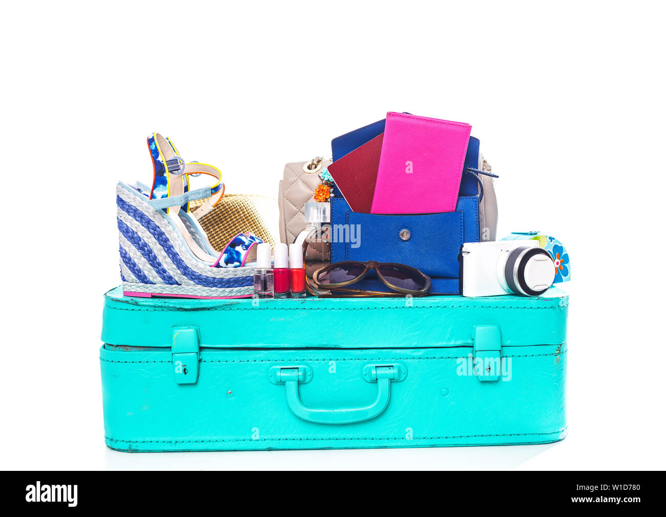 Packing suitcase for trip isolated on white Stock Photo - Alamy