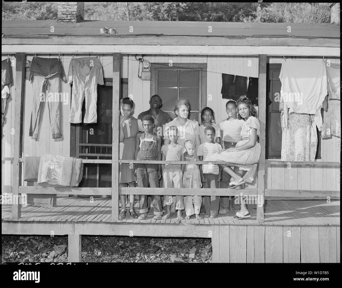 Front porch and family of Furman Currington, miner, who lives in ...
