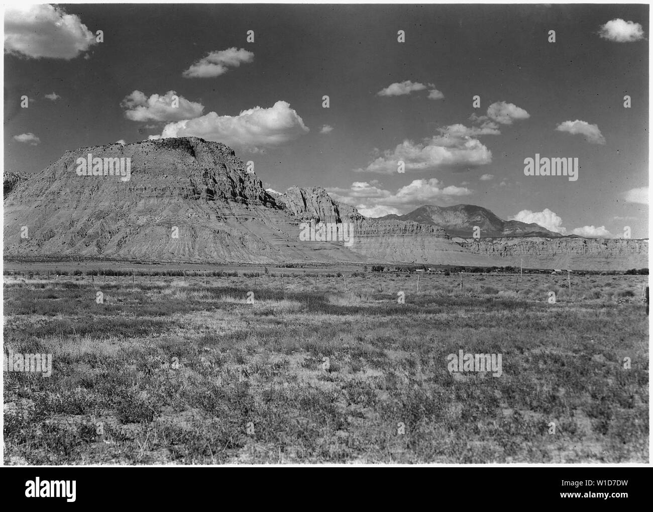 Front of Vermillion Cliffs. Village of Ivins, Utah, at base. Southern ...