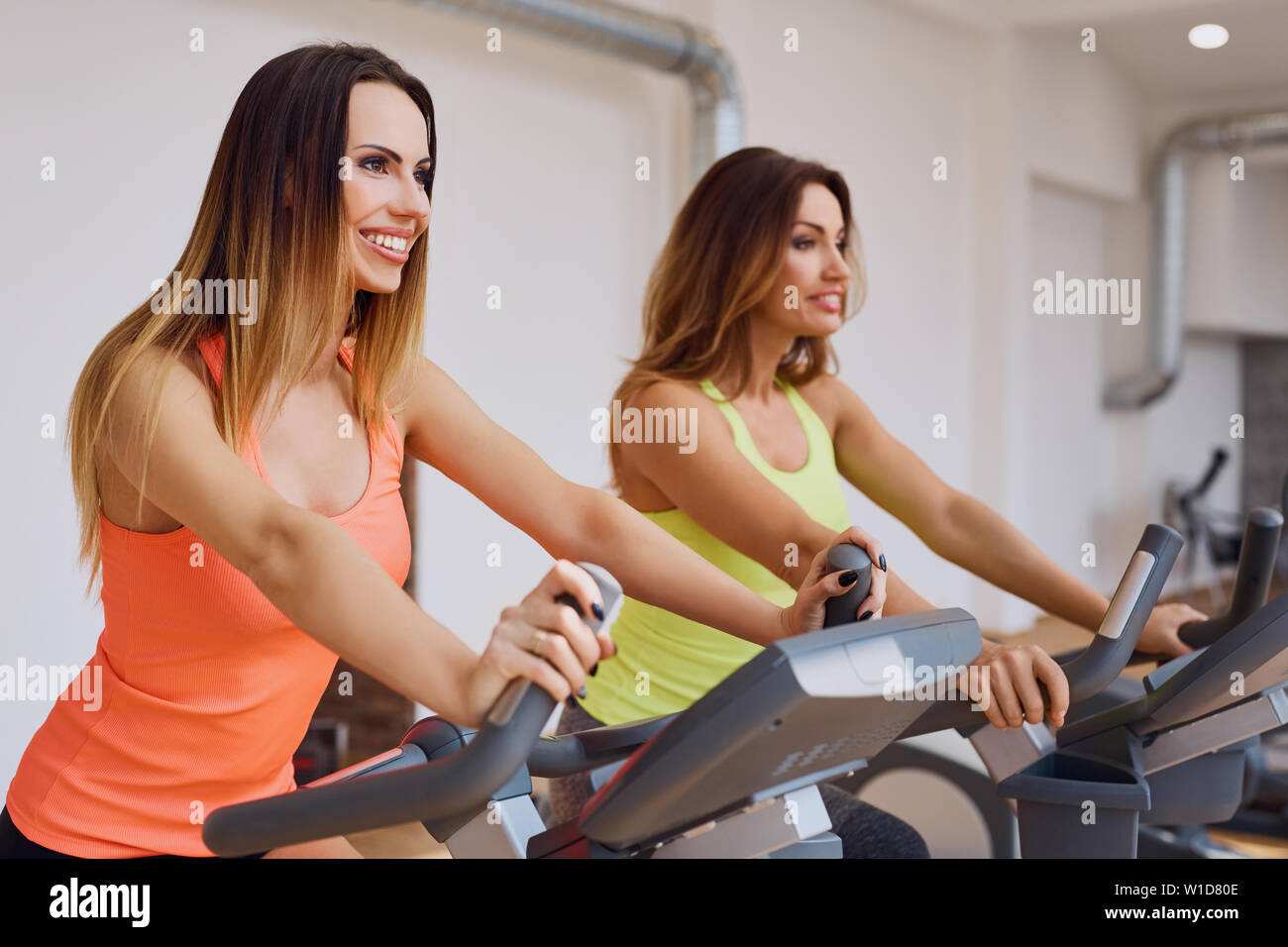 Girl exercise bike fitness health woman slim cycling hi-res stock ...