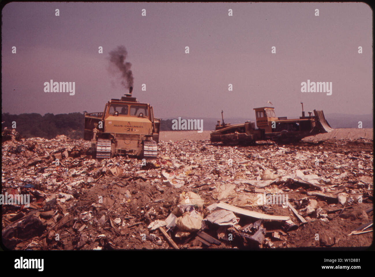 GARBAGE IS SPREAD AND COMPACTED IN LANDFILL OPERATION AT CROTON DUMP ...