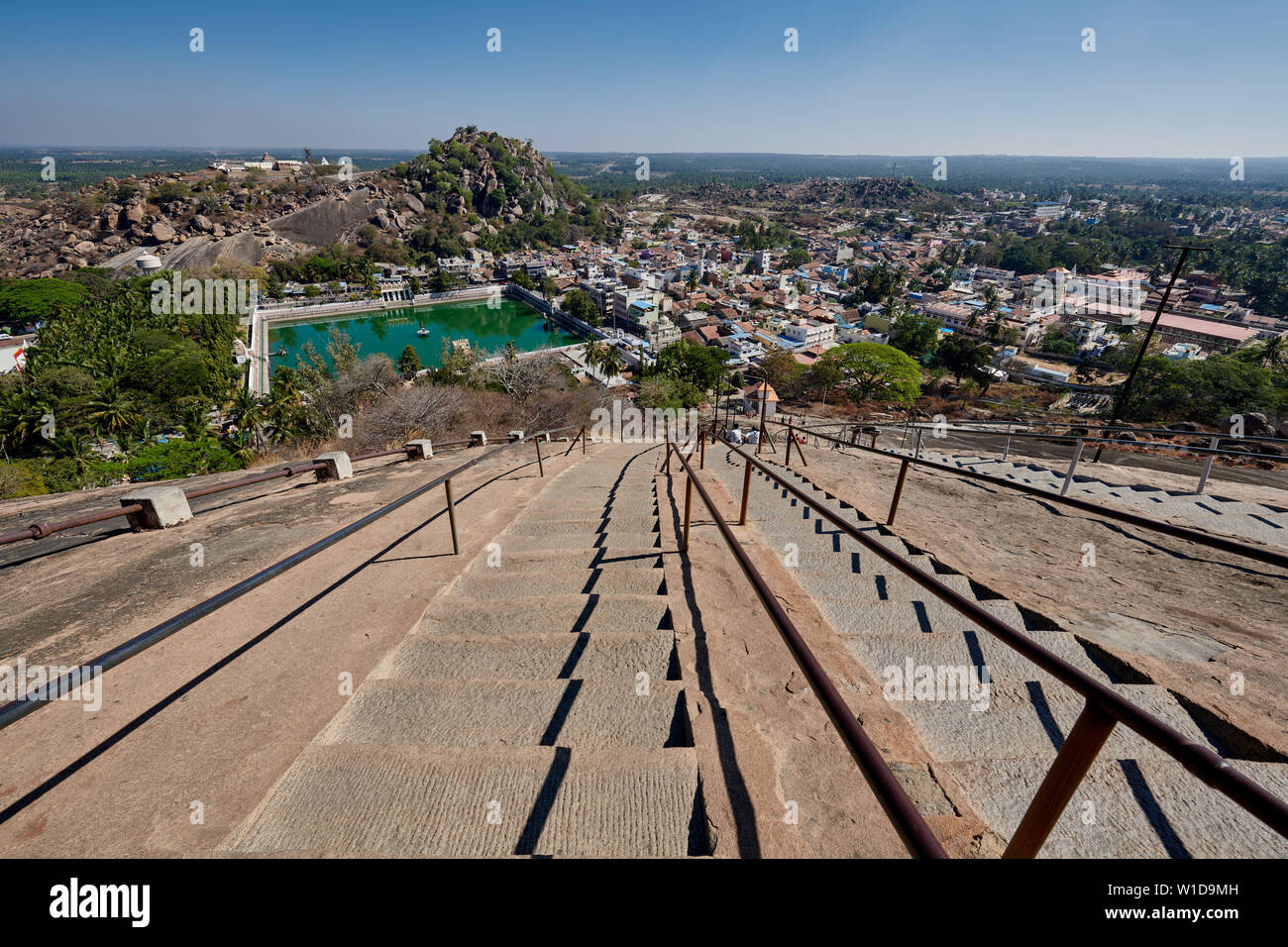 steps on steep hill to Shravanabelagola Jain temple with huge ...