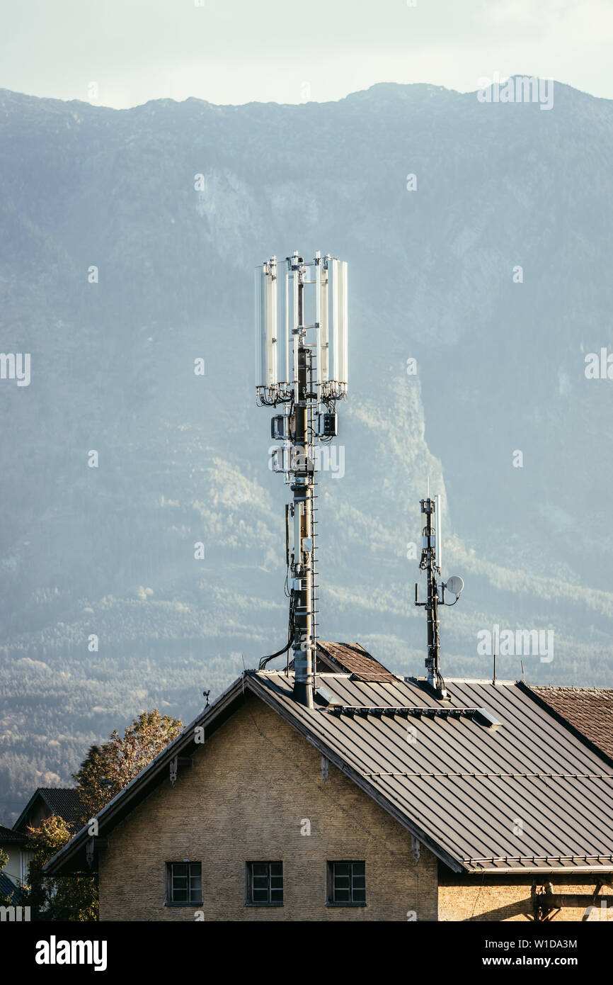 Communication transmitter on the rooftop of a house Stock Photo - Alamy