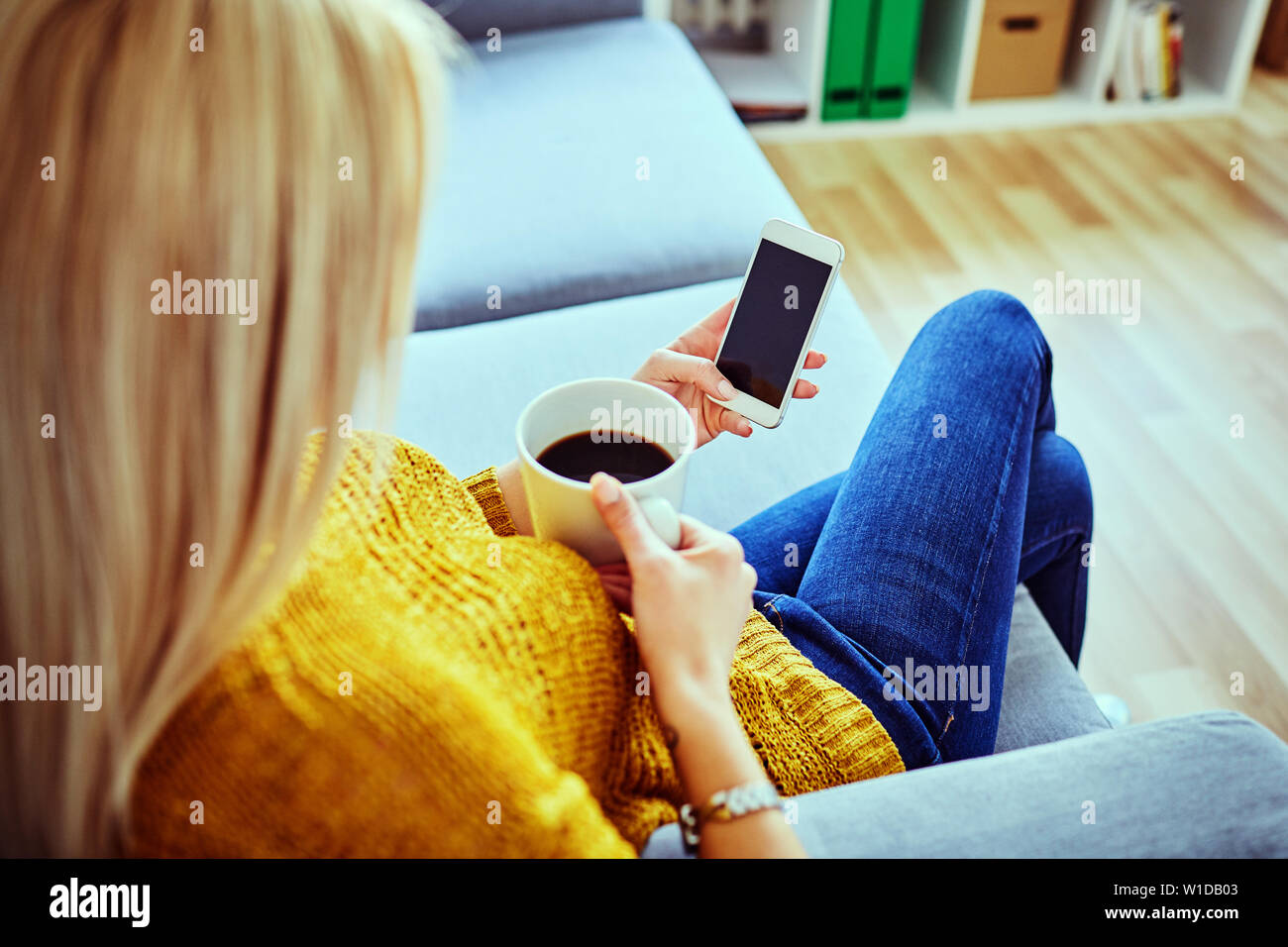 Mobile phone with copy space on sofa hi-res stock photography and ...