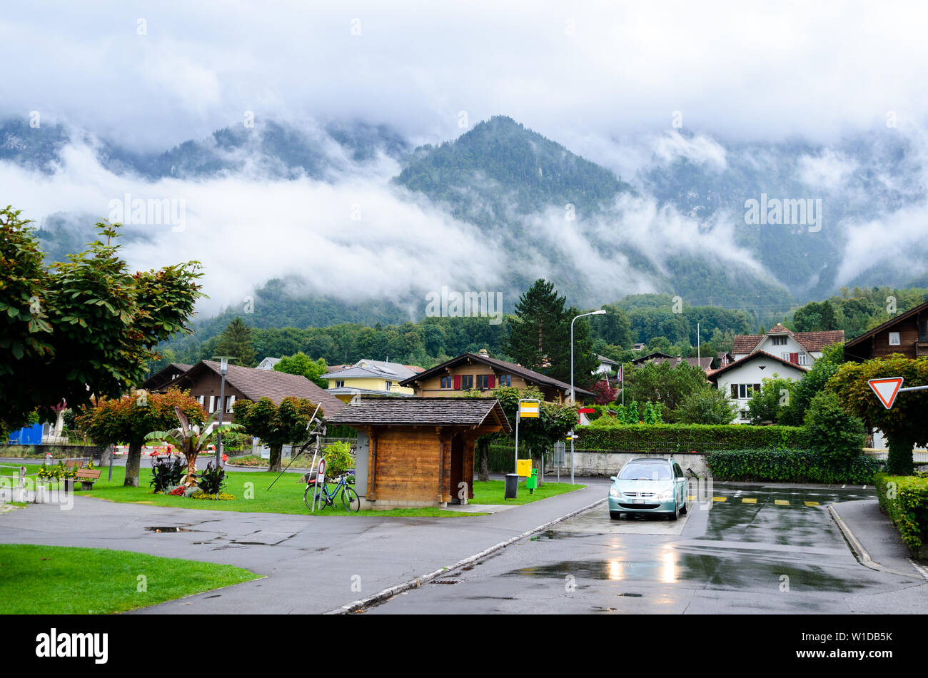Cloudy alps mountains in Interlaken between Thunersee, lake of Thun and ...