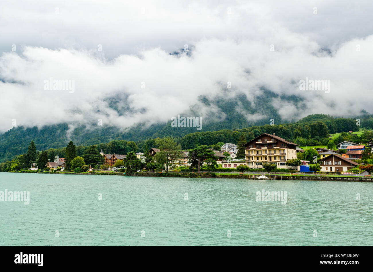 Brienzersee, lake of Brienz with cloudy alps mountains in clouds ...