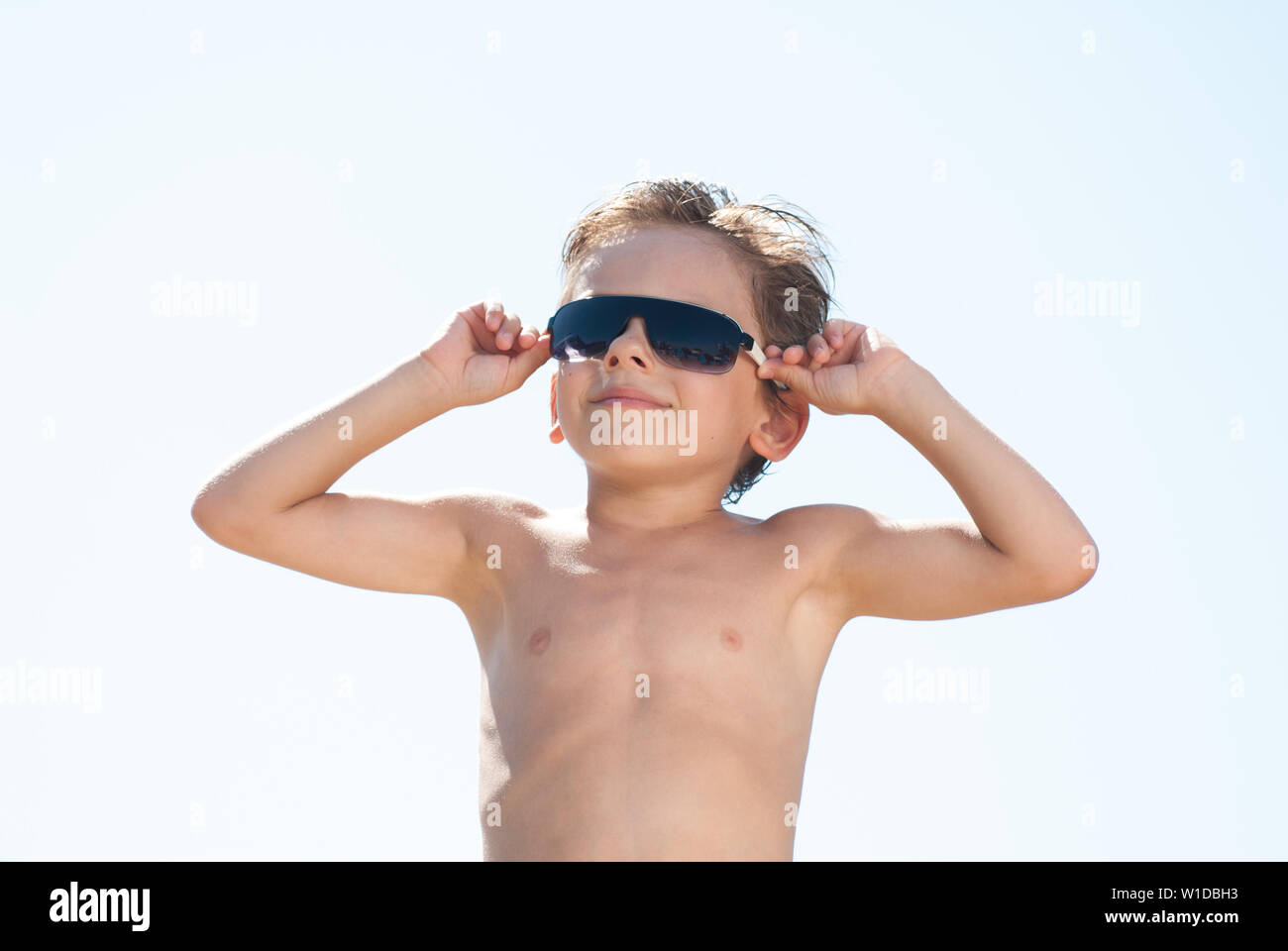 happy cute smiling little boy with healthy body in sunglasses ...
