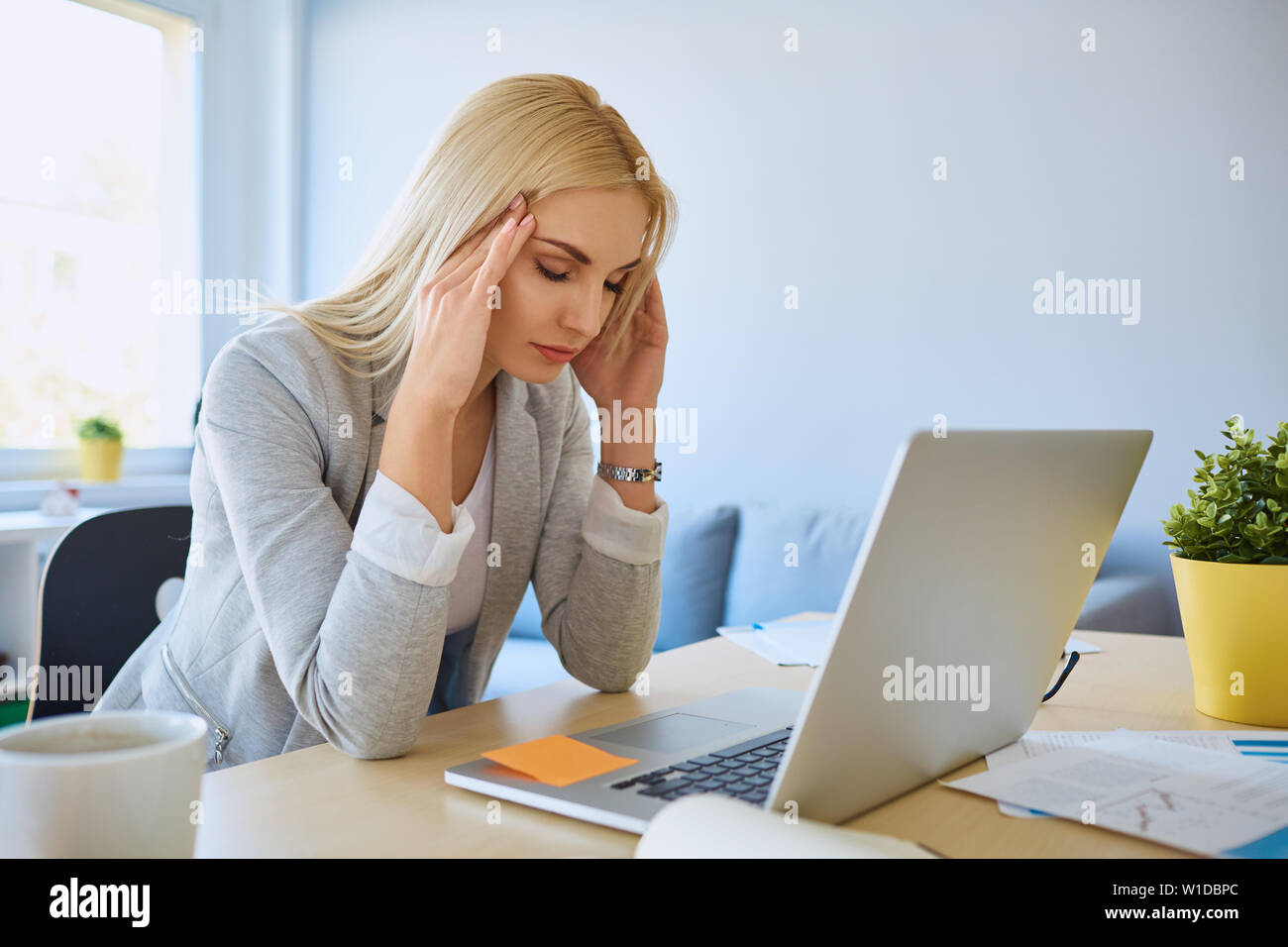 Woman headache from working computer hi-res stock photography and ...