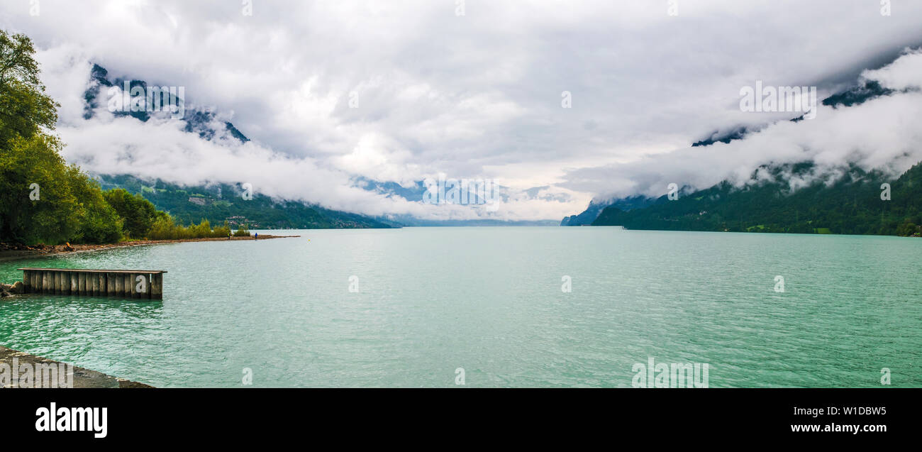 Brienzersee, lake of Brienz with cloudy alps mountains in clouds ...