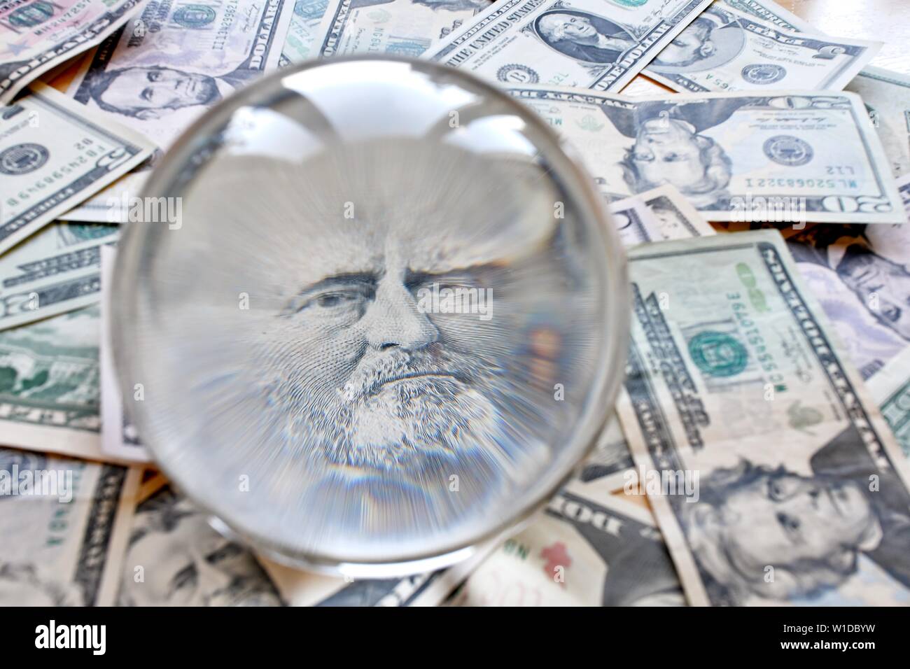 US dollar bill seen through a crystal ball. Creative concept, business ...