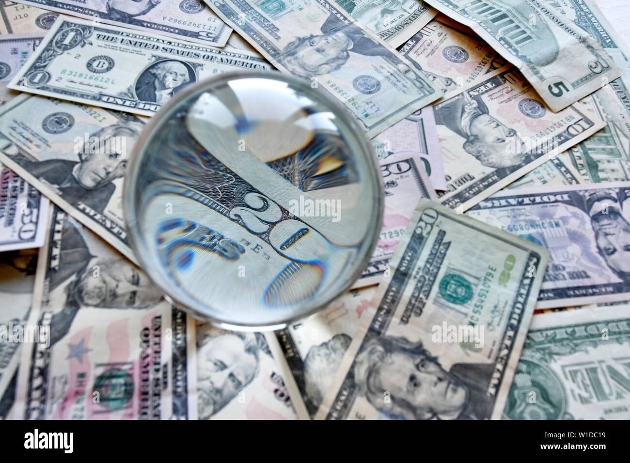 US dollar bill seen through a crystal ball. Creative concept, business ...