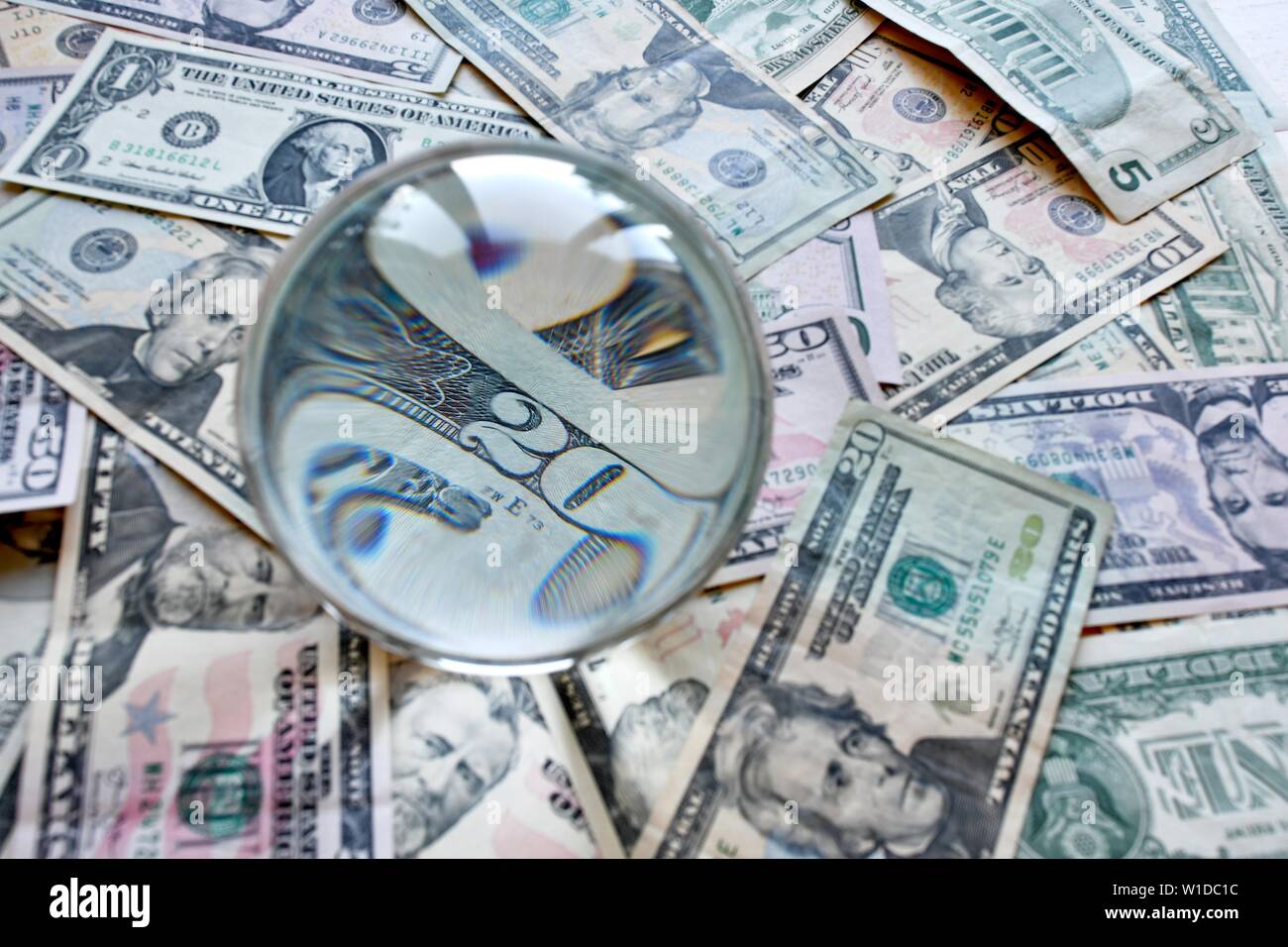 US dollar bill seen through a crystal ball. Creative concept, business ...