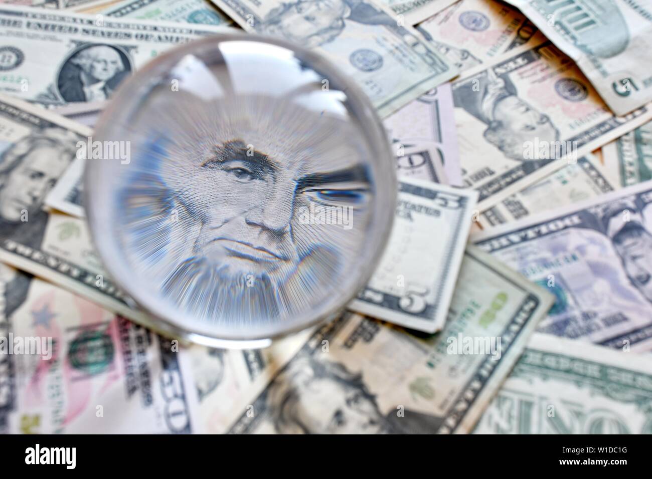 US dollar bill seen through a crystal ball. Creative concept, business ...