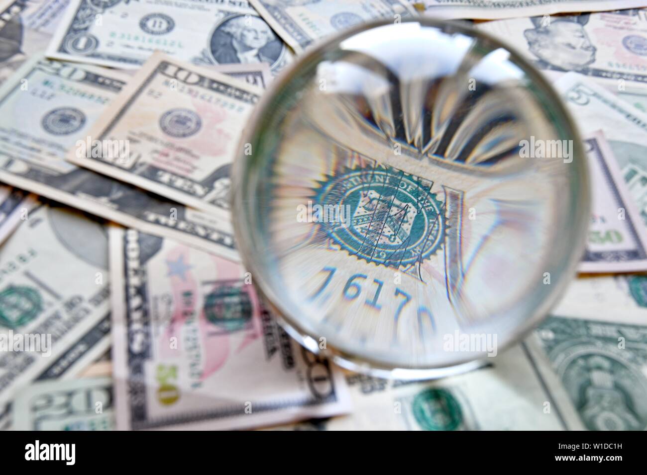 US dollar bill seen through a crystal ball. Creative concept, business ...