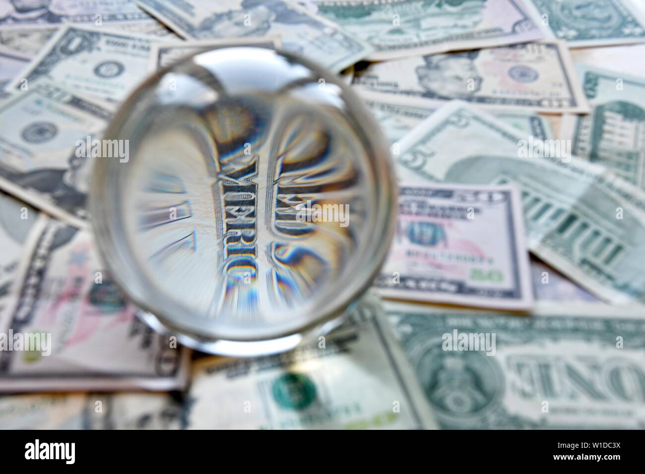 US dollar bill seen through a crystal ball. Creative concept, business ...
