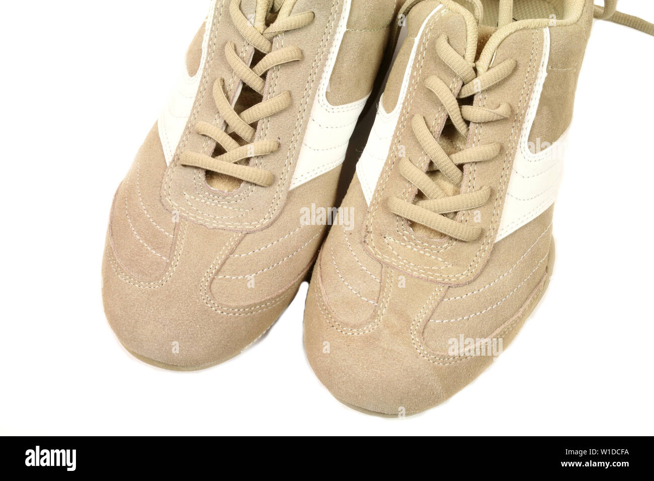 beige sport shoes - sneakers isolated on white background Stock Photo ...